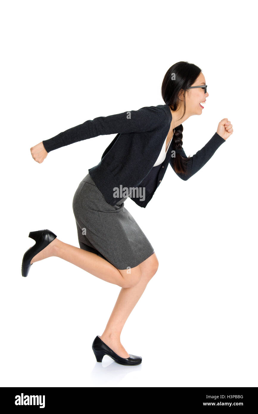 Full length portrait of young Asian woman running, isolated on white ...