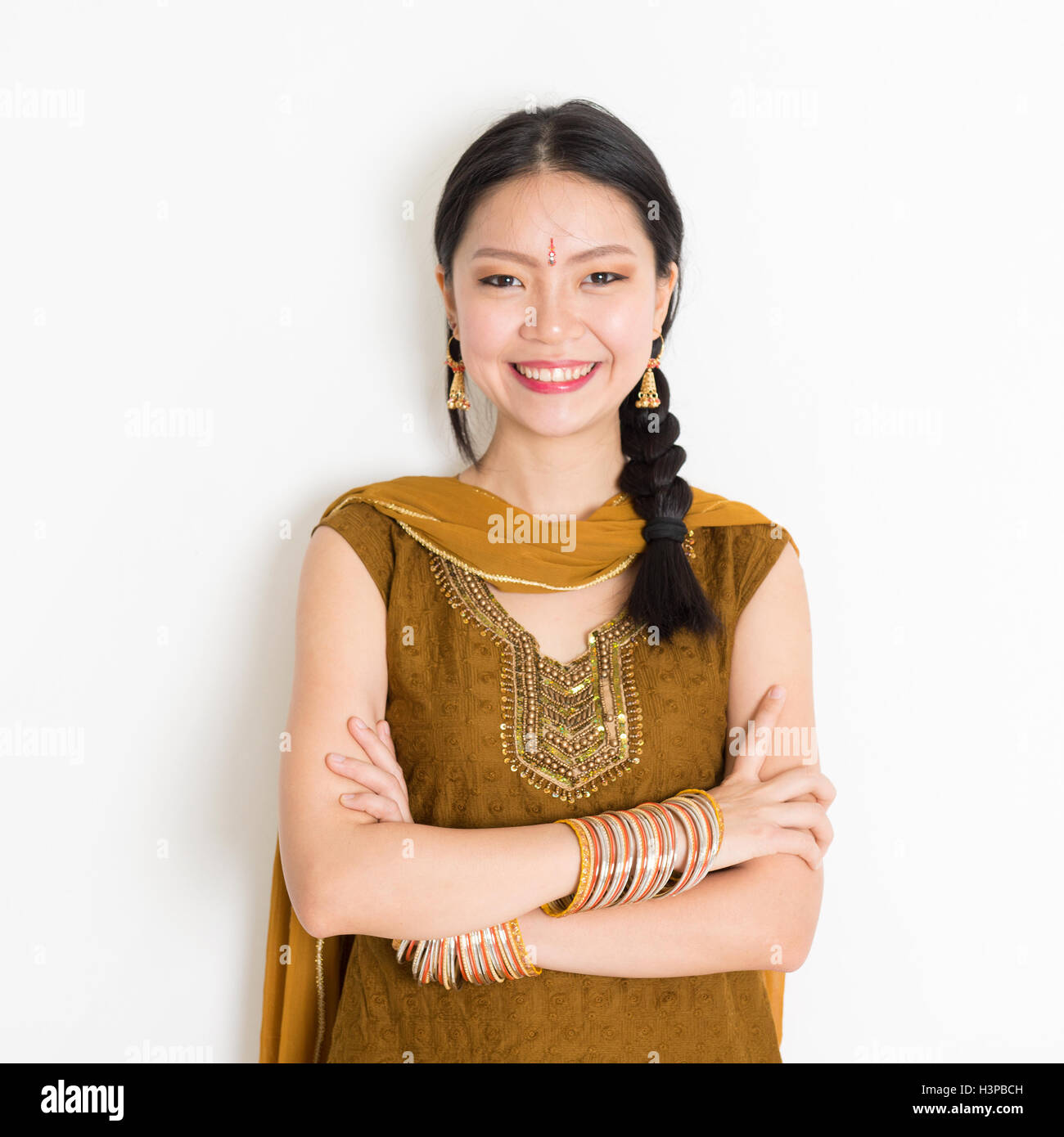 Portrait Of Arms Crossed Mixed Race Indian Chinese Female In