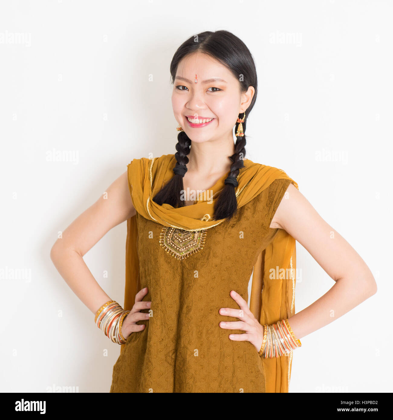 Portrait of beautiful mixed race Indian Chinese girl in traditional ...