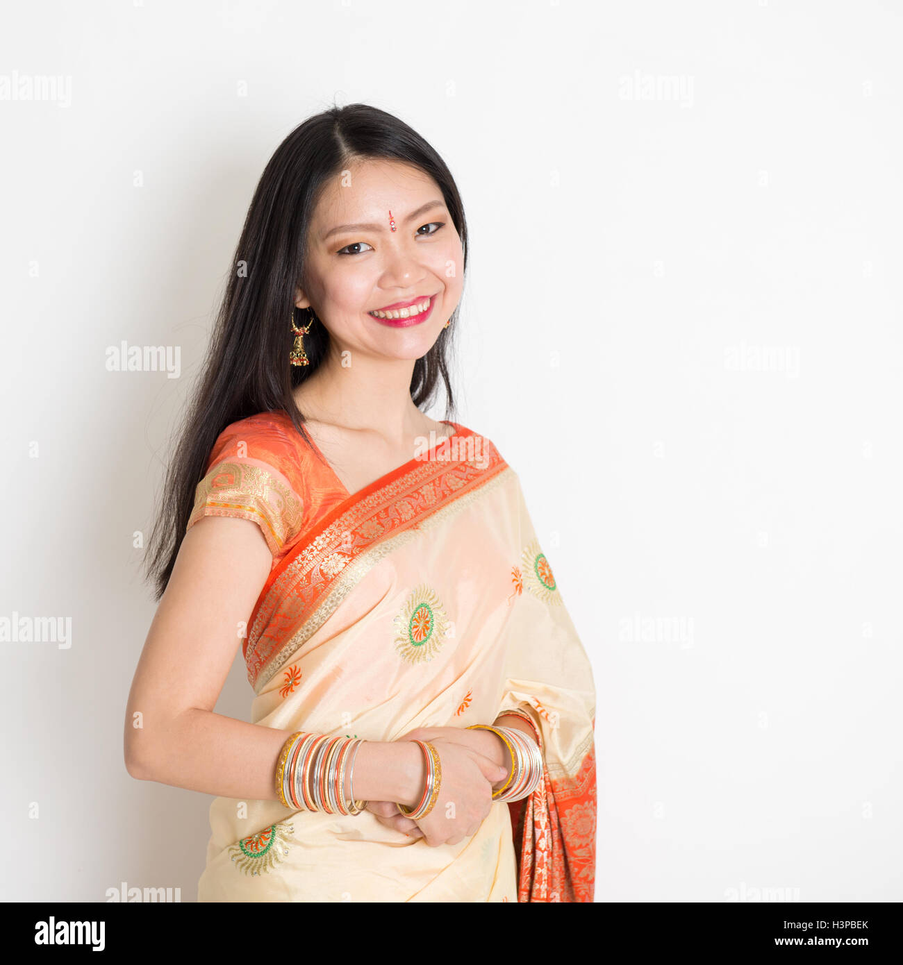 Portrait of mixed race Indian Chinese girl with traditional sari dress ...
