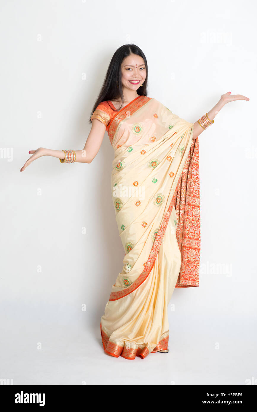 Portrait of young mixed race Indian Chinese woman in traditional sari ...