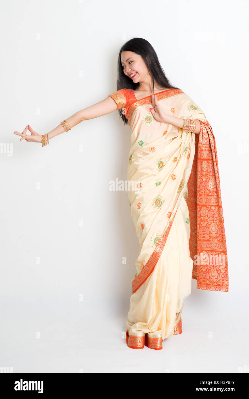Portrait of young mixed race Indian Chinese woman in traditional sari ...