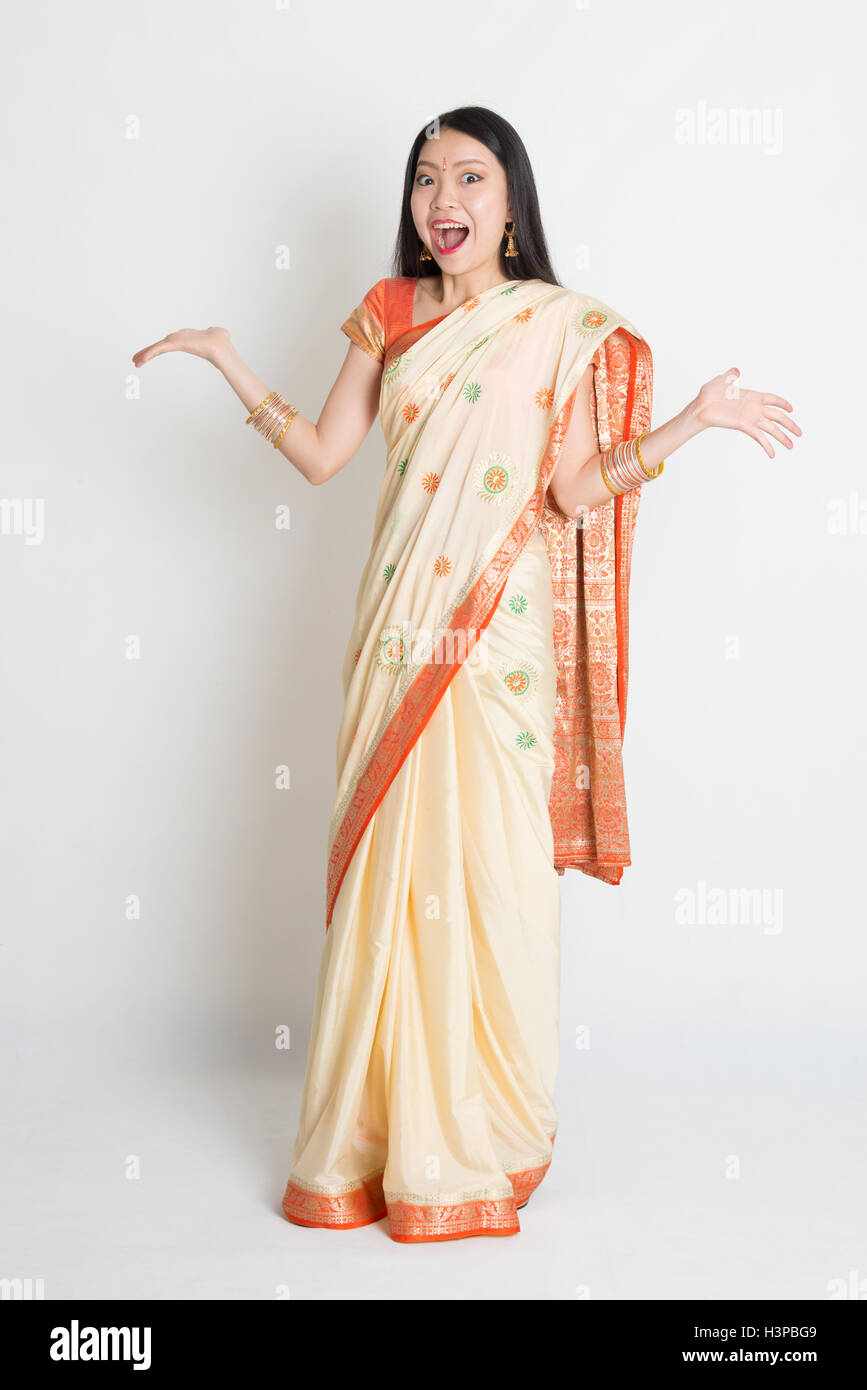 Portrait of surprised young mixed race Indian Chinese female in ...