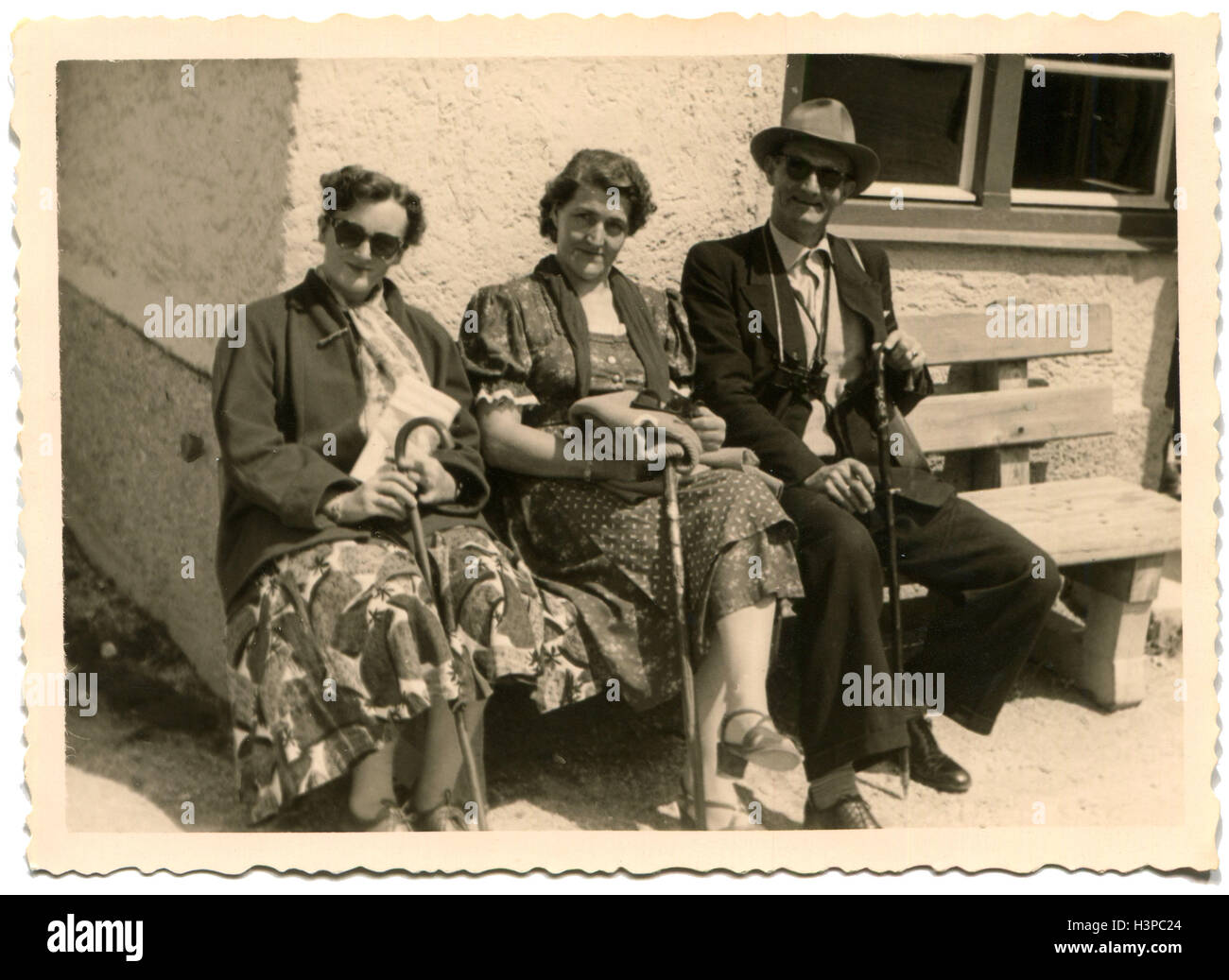 GERMANY - CIRCA 1950s: Two women and a man are holding sticks and ...