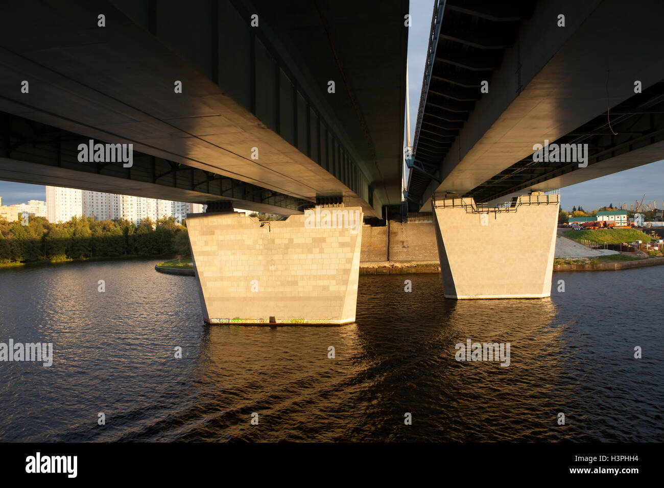 Under a bridge perspective from ship in sunset Stock Photo - Alamy