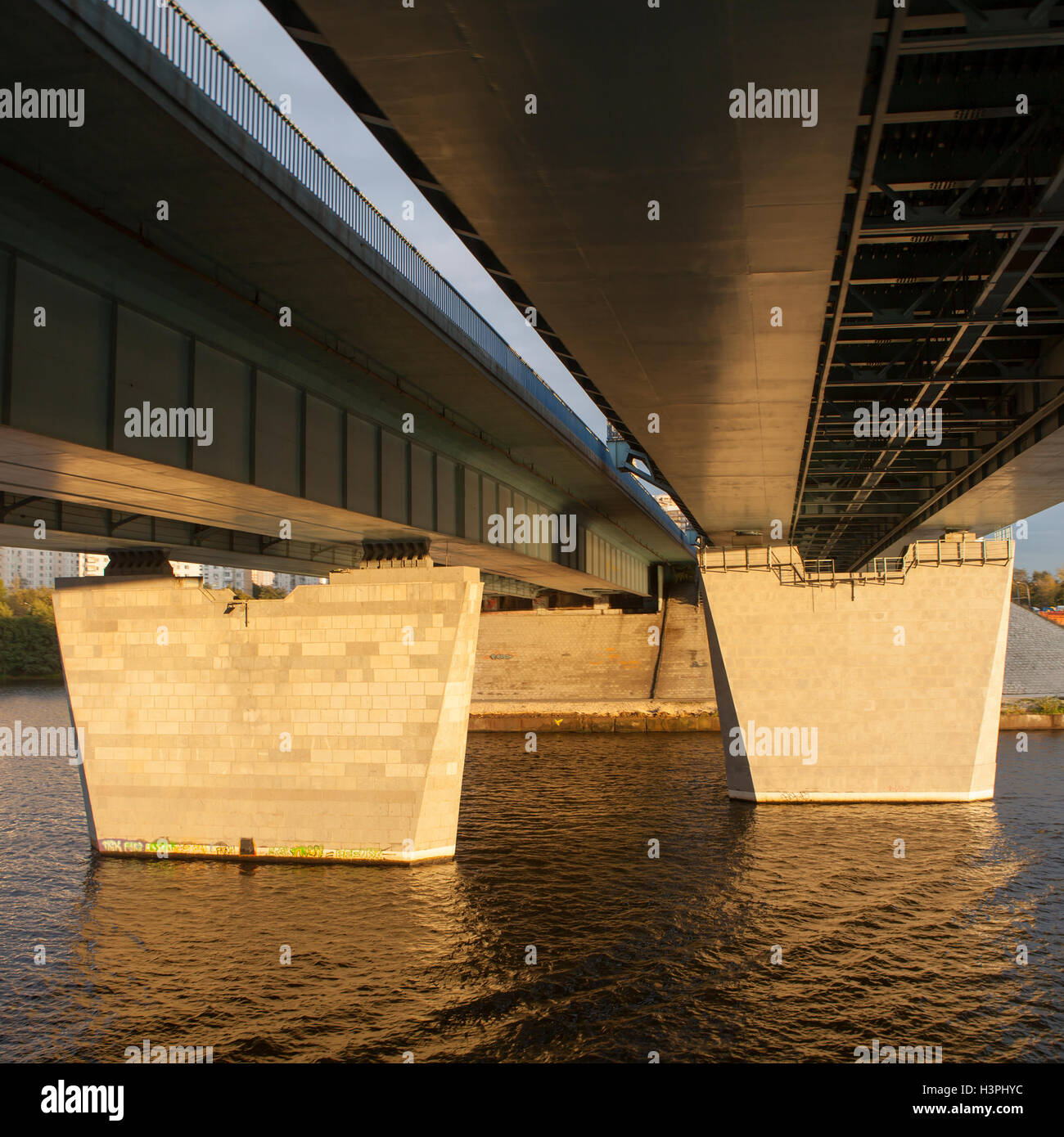 Under a bridge perspective from ship in sunset Stock Photo - Alamy