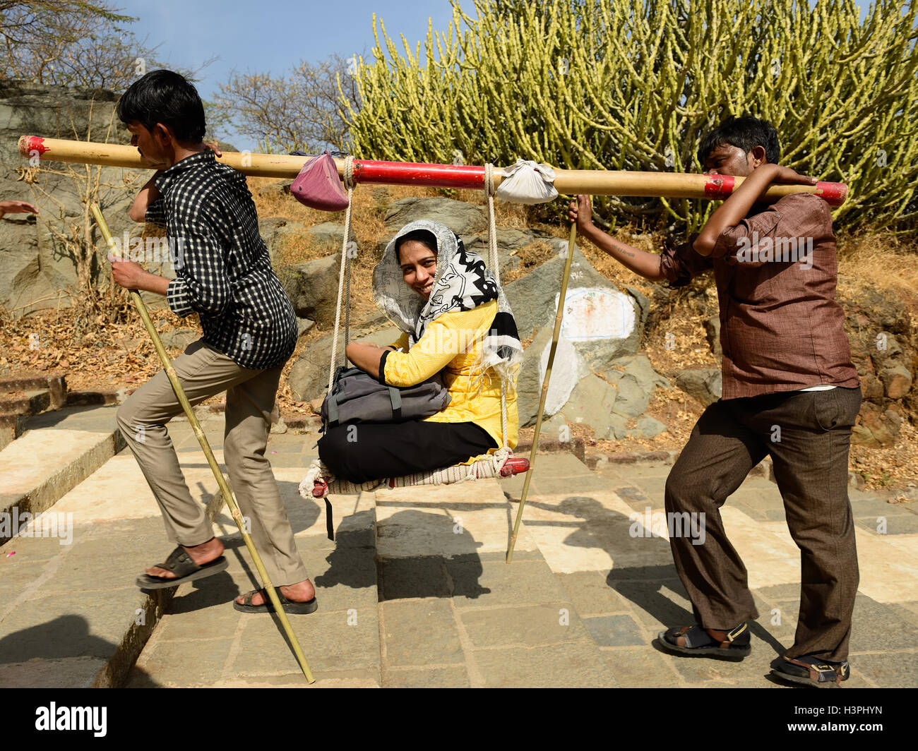 PALITANA, GUJARAT, INDIA - JANUARY 25: Indian pilgrims carried on ...