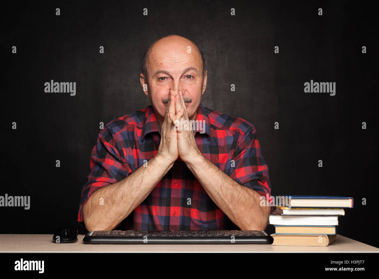 Elderly man covered his face with fatigue Stock Photo - Alamy