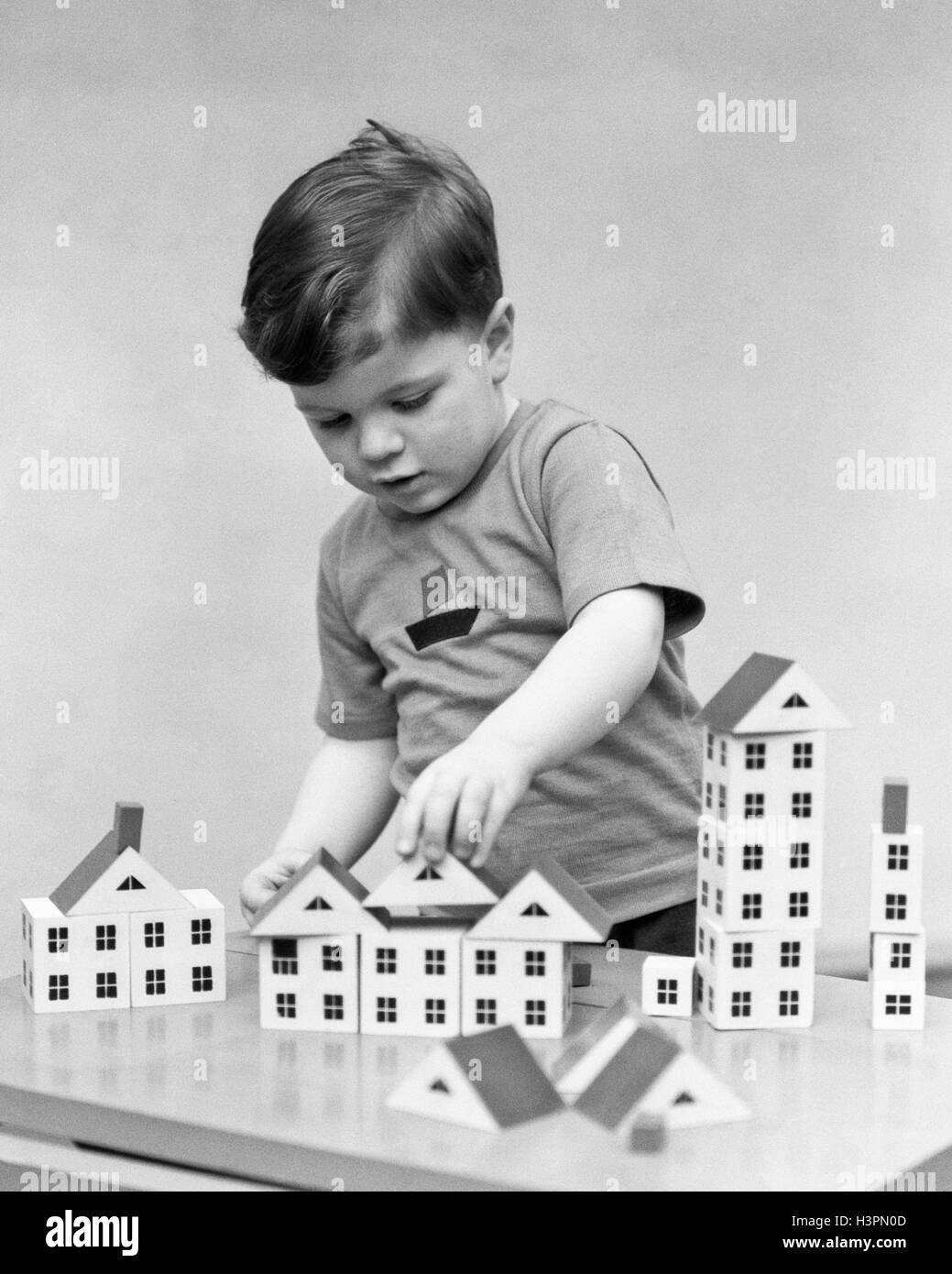 Playing with building blocks Black and White Stock Photos & Images - Alamy