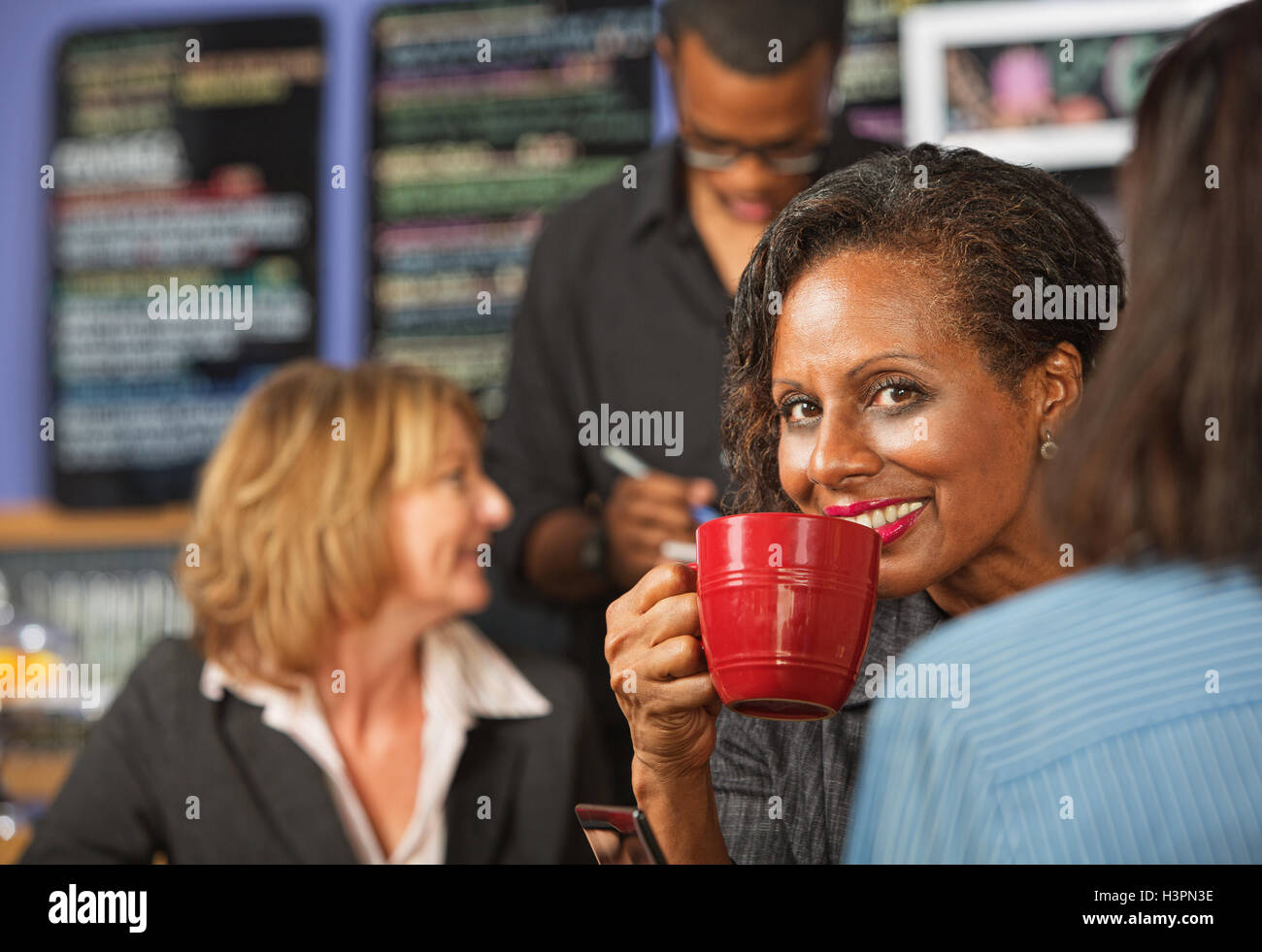 Woman Sipping Coffee Stock Photo - Alamy