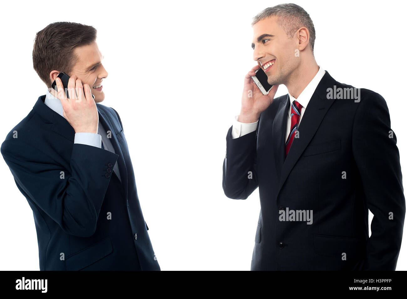 Handsome businessmen with cell phones Stock Photo - Alamy