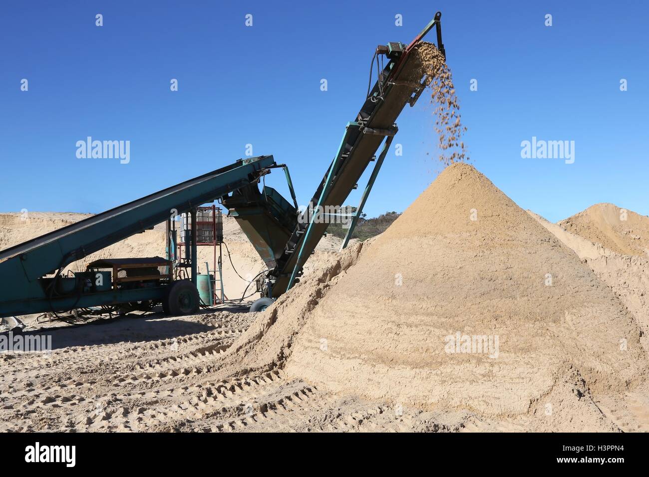 Sand Pile and Screening Machine Stock Photo - Alamy