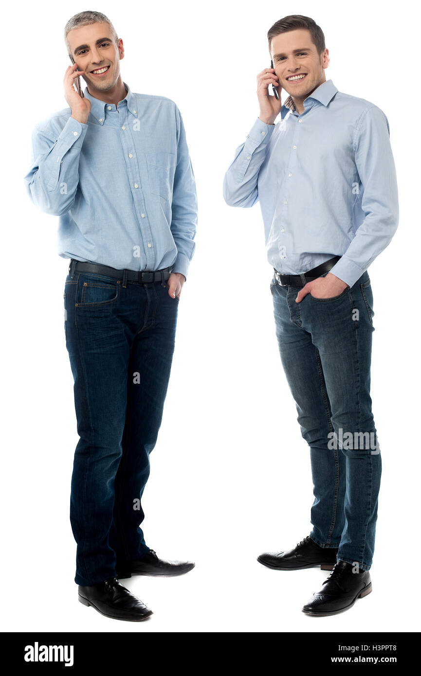 Two young men talking through mobile phone Stock Photo - Alamy Two young men talking through mobile phone Stock Photo - Alamy