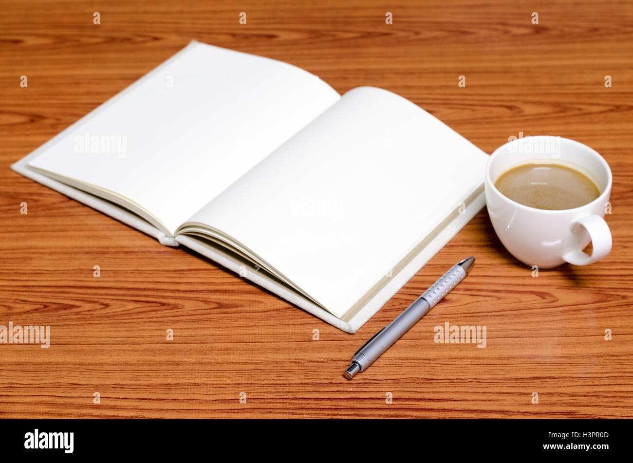 coffee and notebook Stock Photo - Alamy