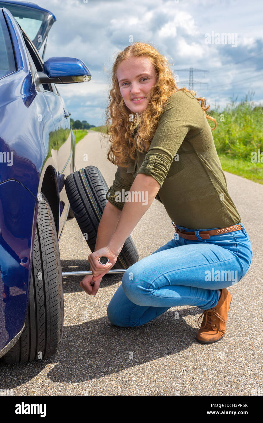 Flat tire woman hi-res stock photography and images - Alamy