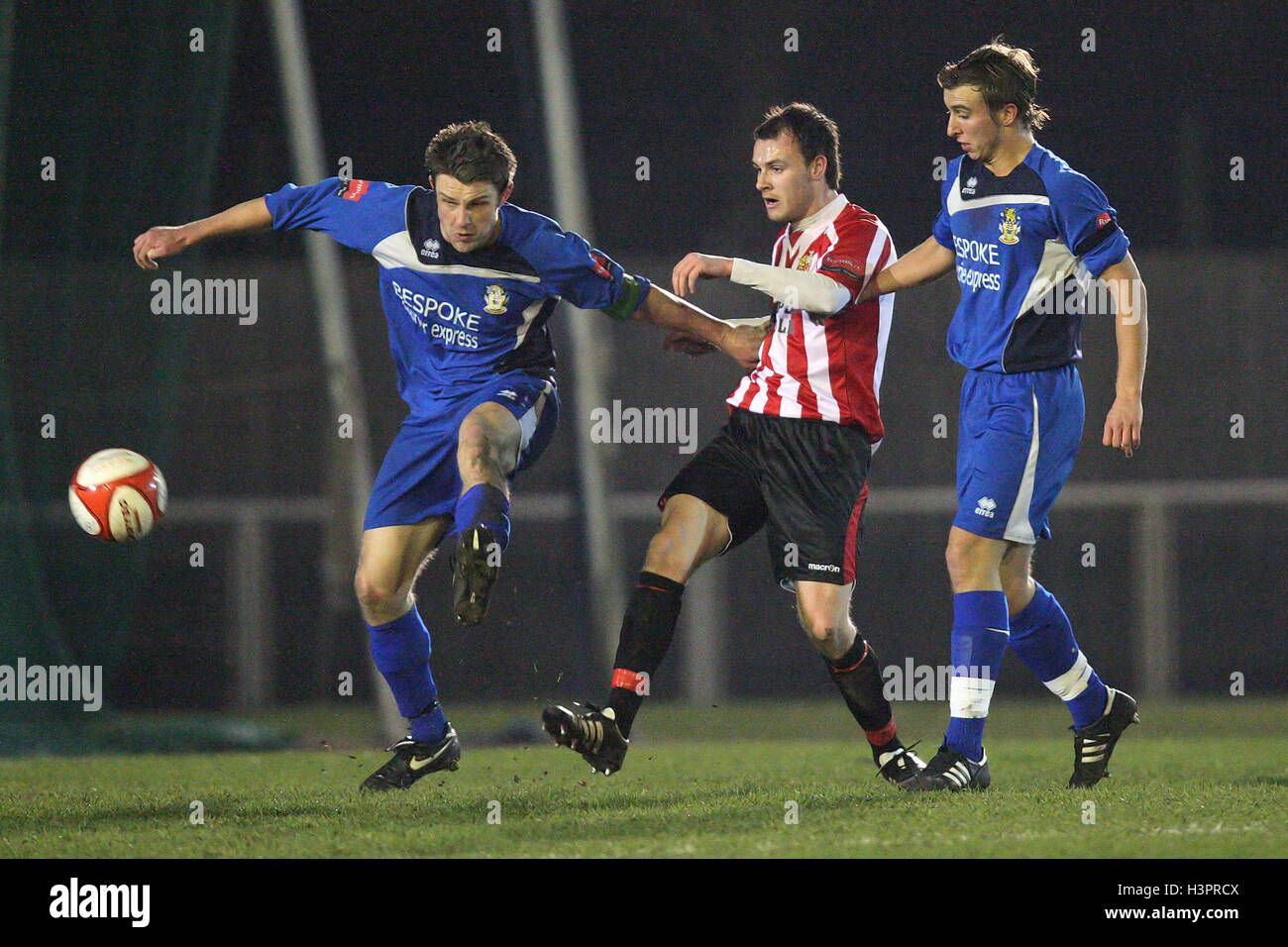 Martin Tuohy of Hornchurch is sandwiched by Tony Russell (L) and ...