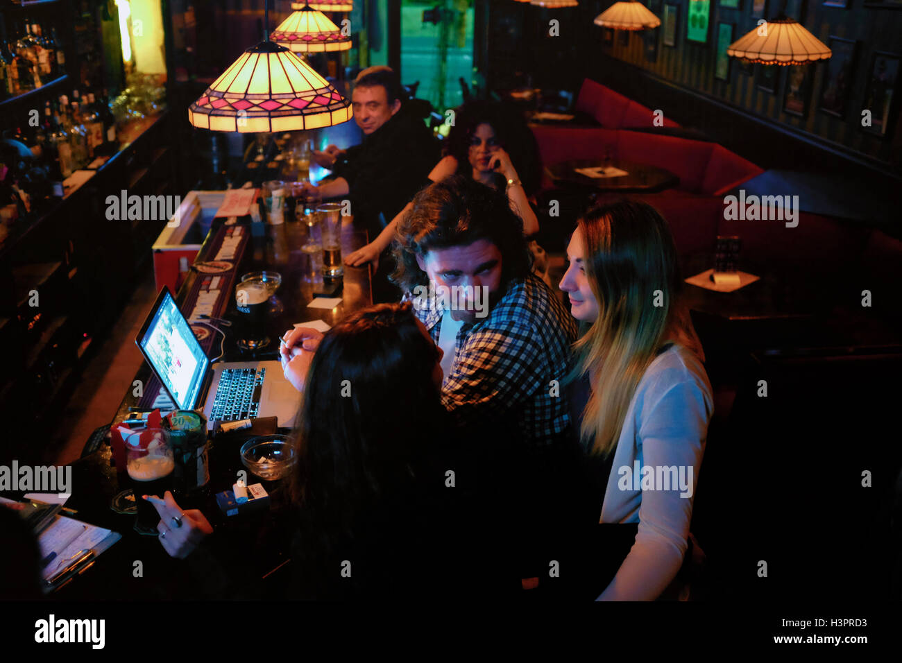 People drinking beer in Putin bar named in honor of Russia's President ...
