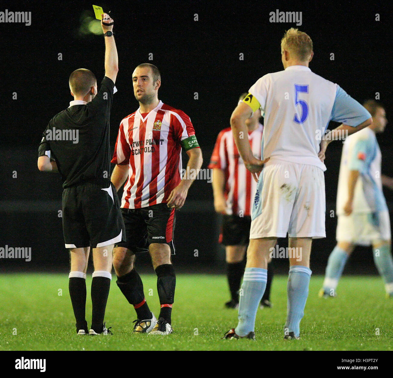 Elliot Styles of Hornchurch is shown a yellow card by referee Hillier ...