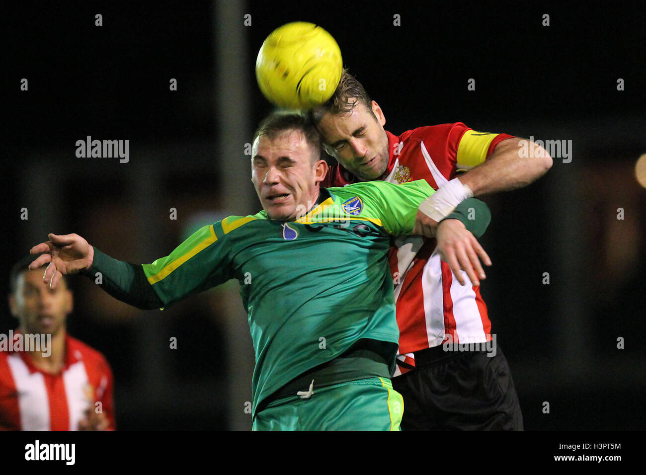 Elliot Styles of Hornchurch rises above Jason Hallett of Canvey - AFC ...