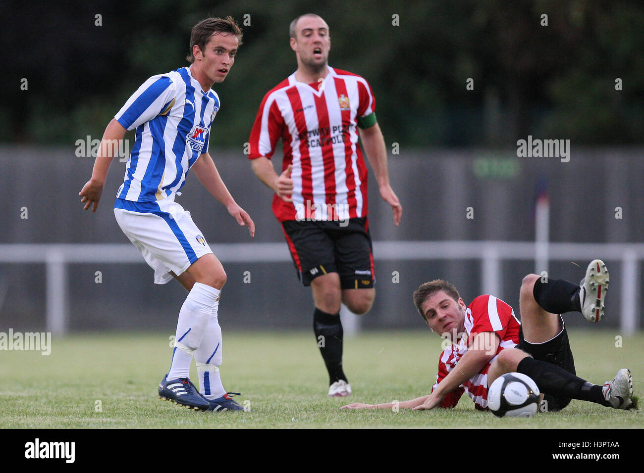 Ronnie Fletcher of Hornchurch takes a tumble as Sam Corcoran looks on ...