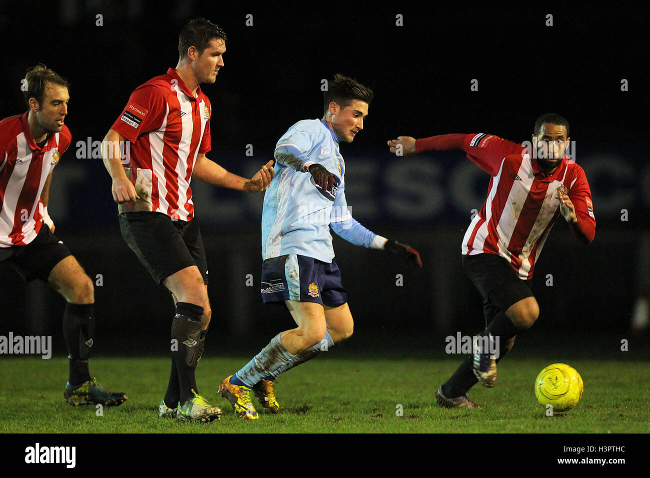 Sean Shields of Dagenham is surrounded by Michael Spencer (R) and ...