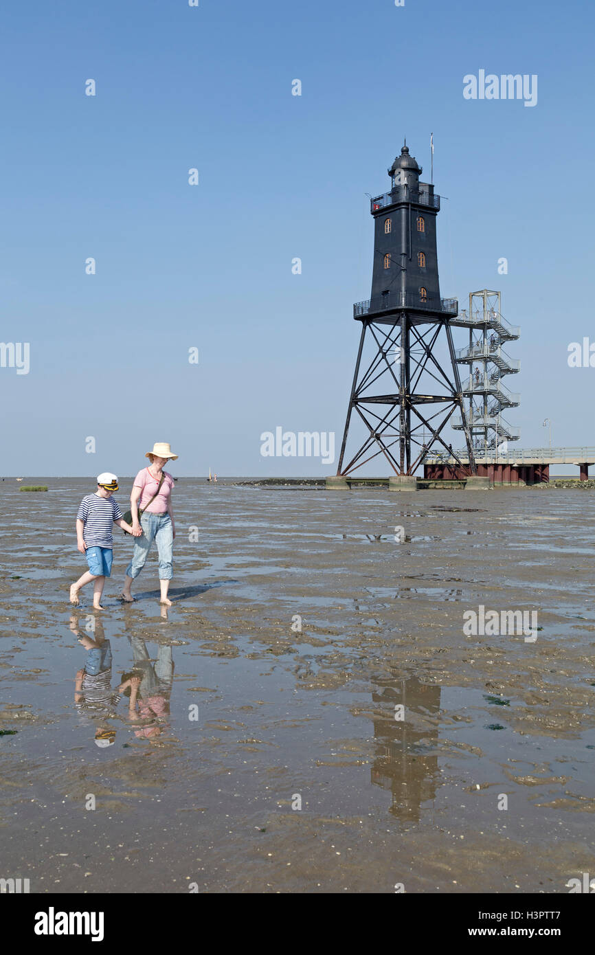 mother and son in mudflats, Dorum Lighthouse, Wurster Land, Lower ...