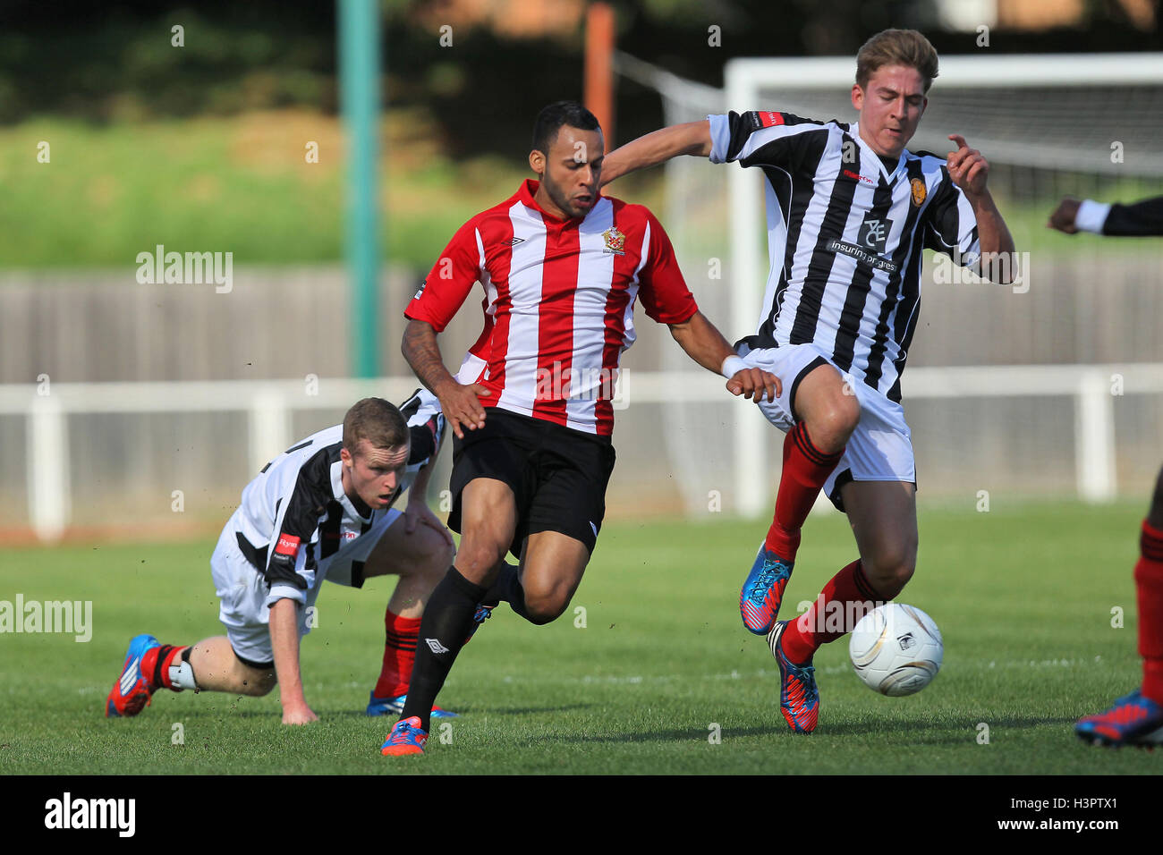 Chris Bourne of AFC Hornchurch and Connor Witherspoon (R) of East ...