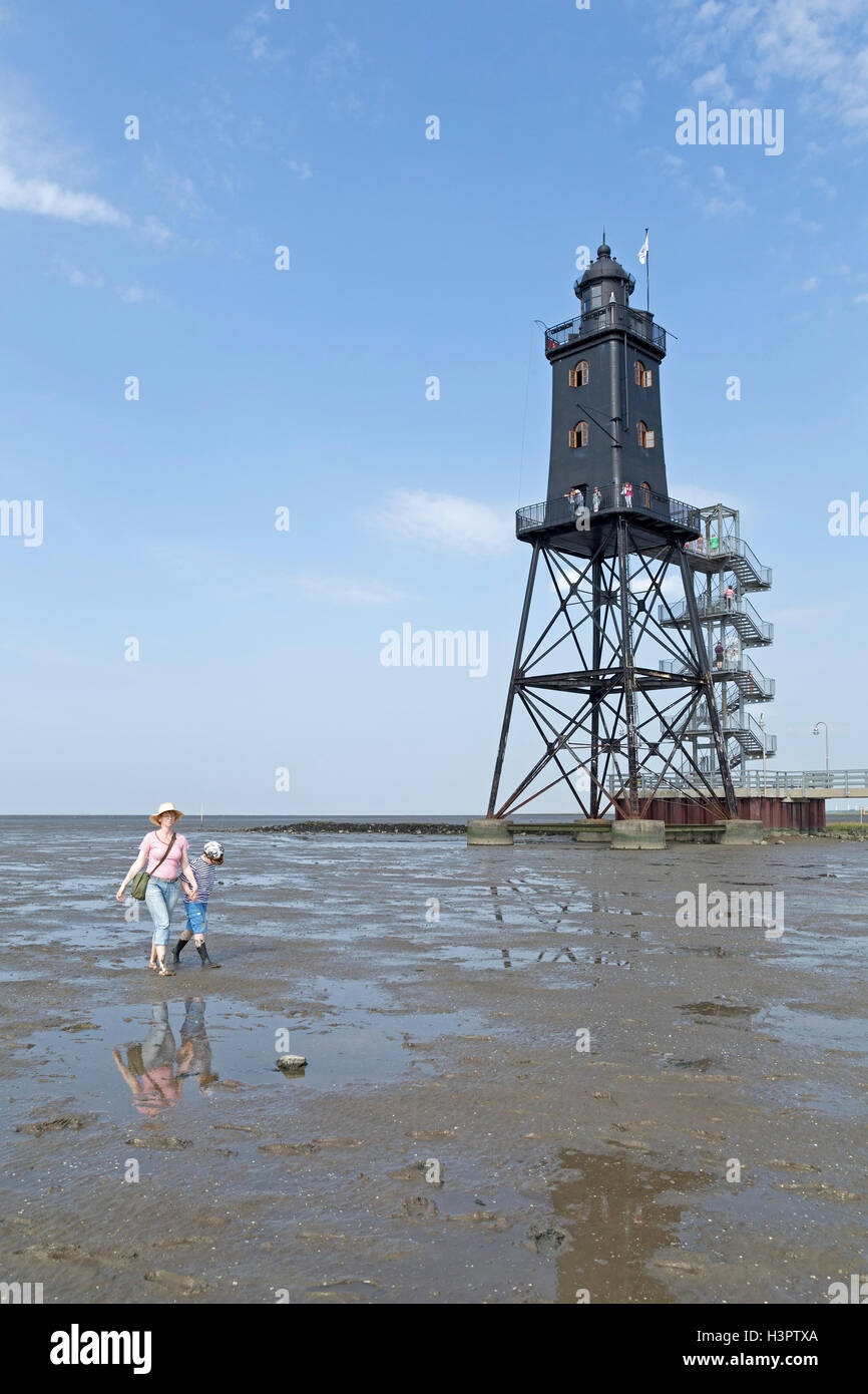 mother and son in mudflats, Dorum Lighthouse, Wurster Land, Lower ...