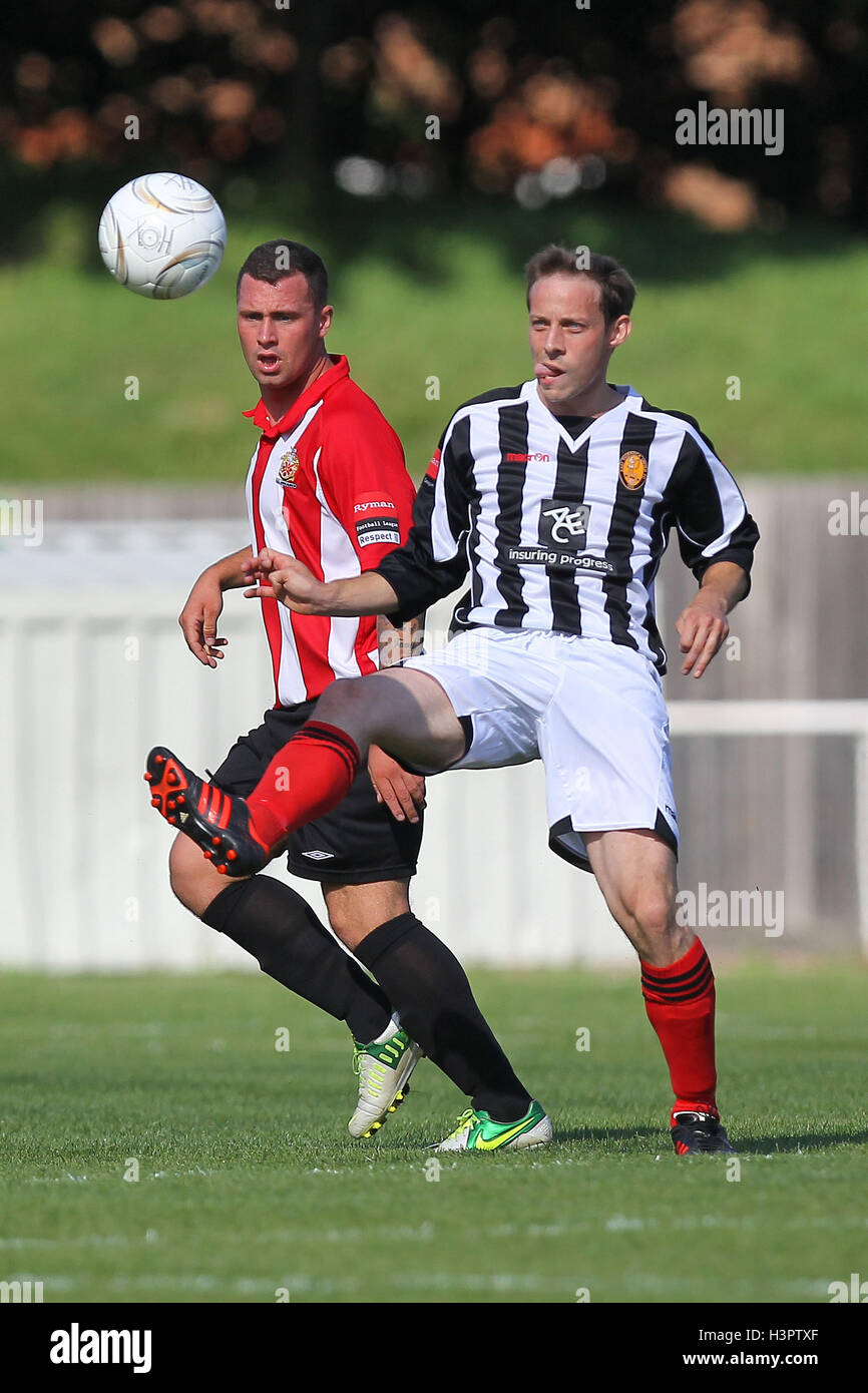 David Bryant of East Thurrock shields the ball from Billy Coyne of AFC ...