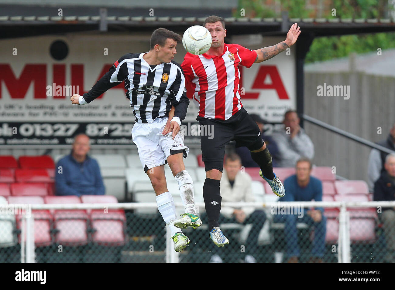 Lea Dawson of East Thurrock rises with Billy Coyne of AFC Hornchurch ...