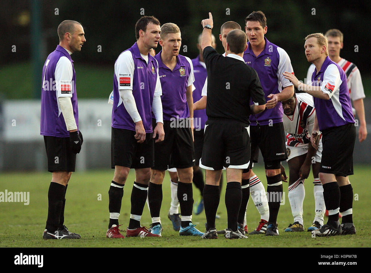 Lewis Smith of Hornchurch protests after being shown a red card by ...