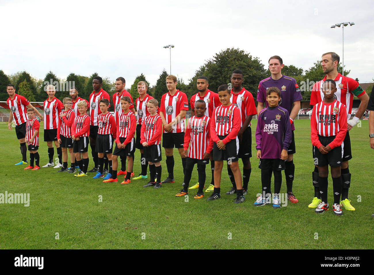 Mascots line up with the AFC Hornchurch players ahead of the kick-off ...