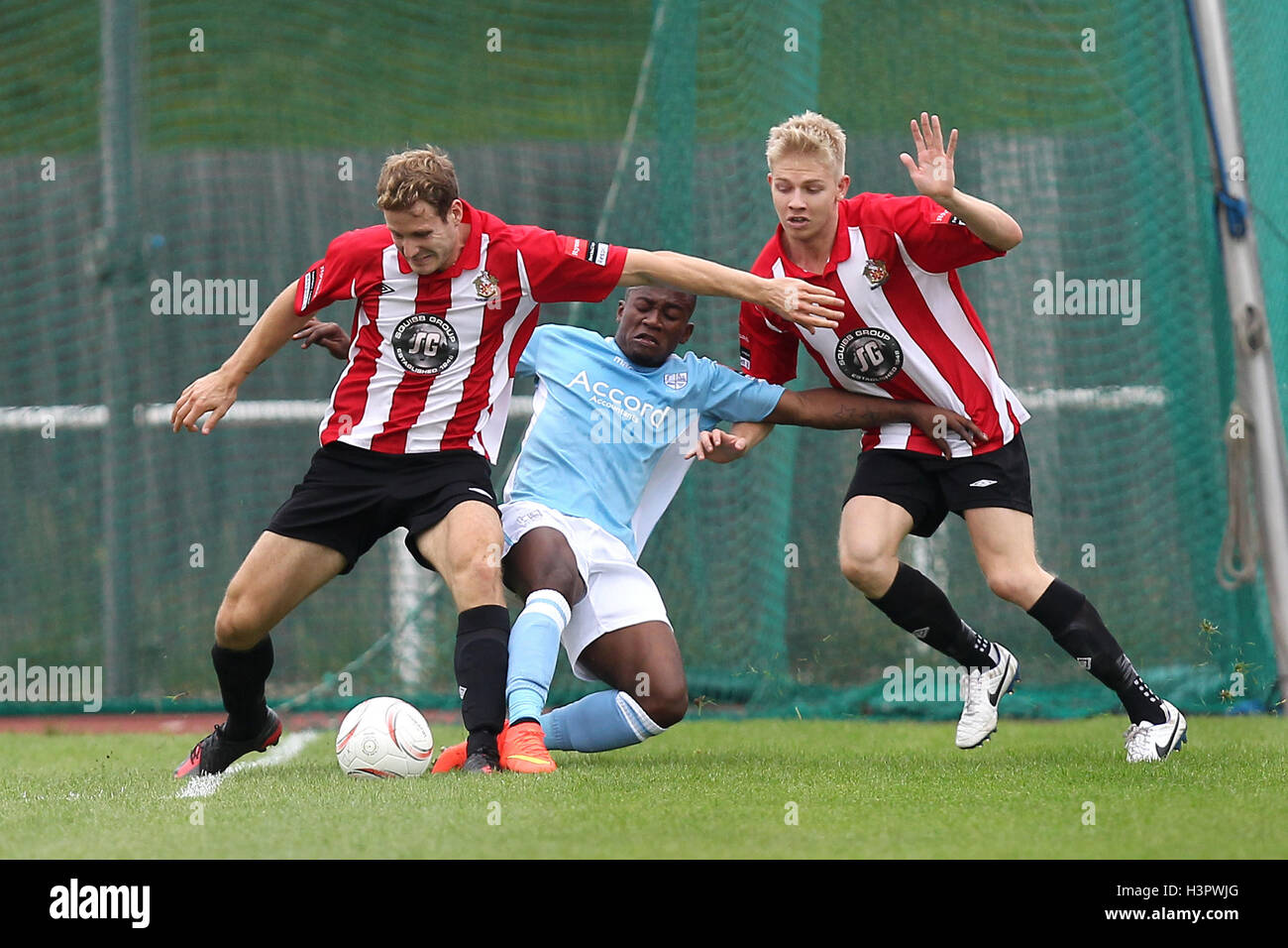 Jerome Federico of Hampton & Richmond Borough is sandwiched by Phil ...
