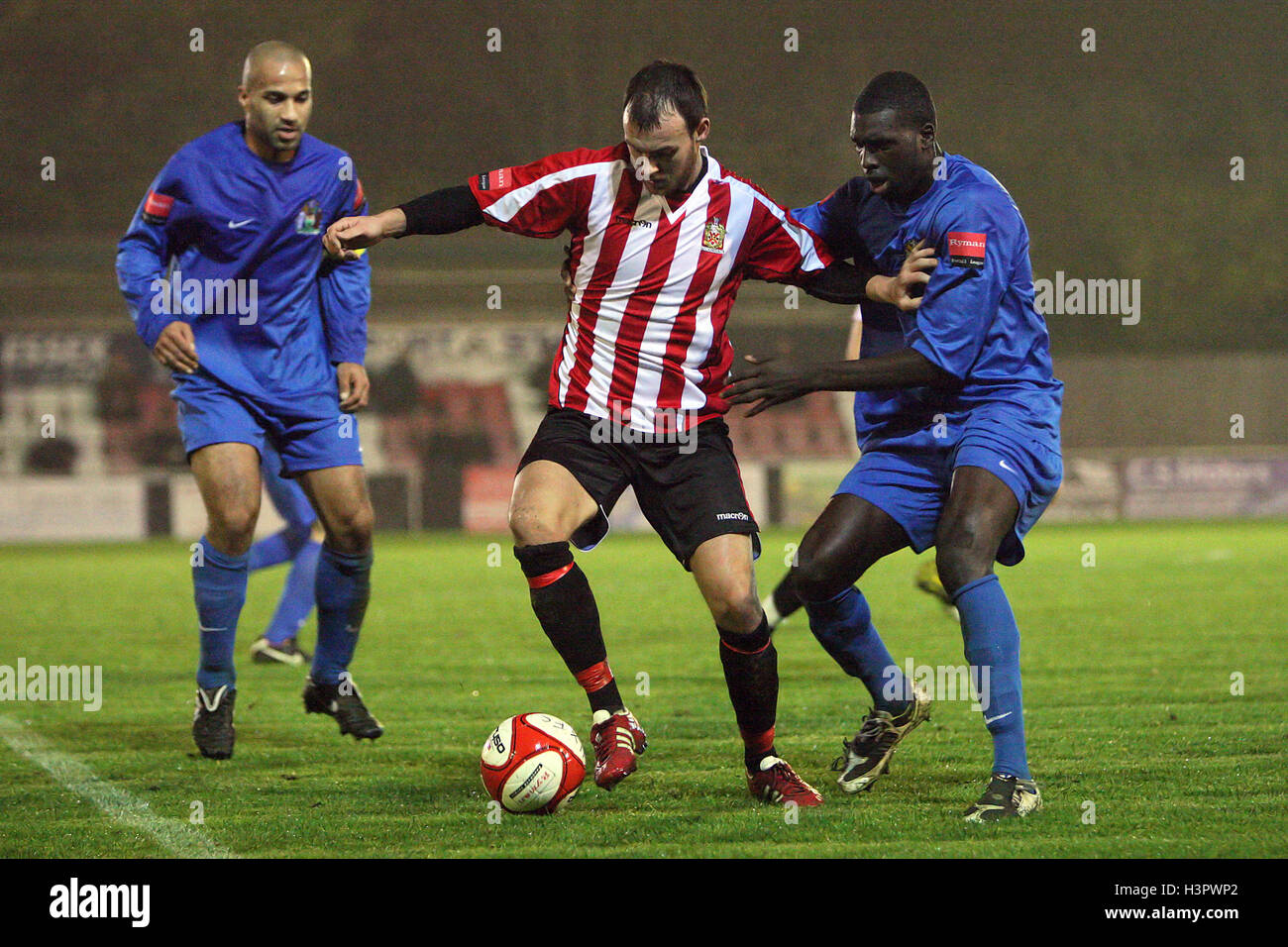 Martin Tuohy of Hornchurch shields the ball from Quincy Rowe of Harrow ...