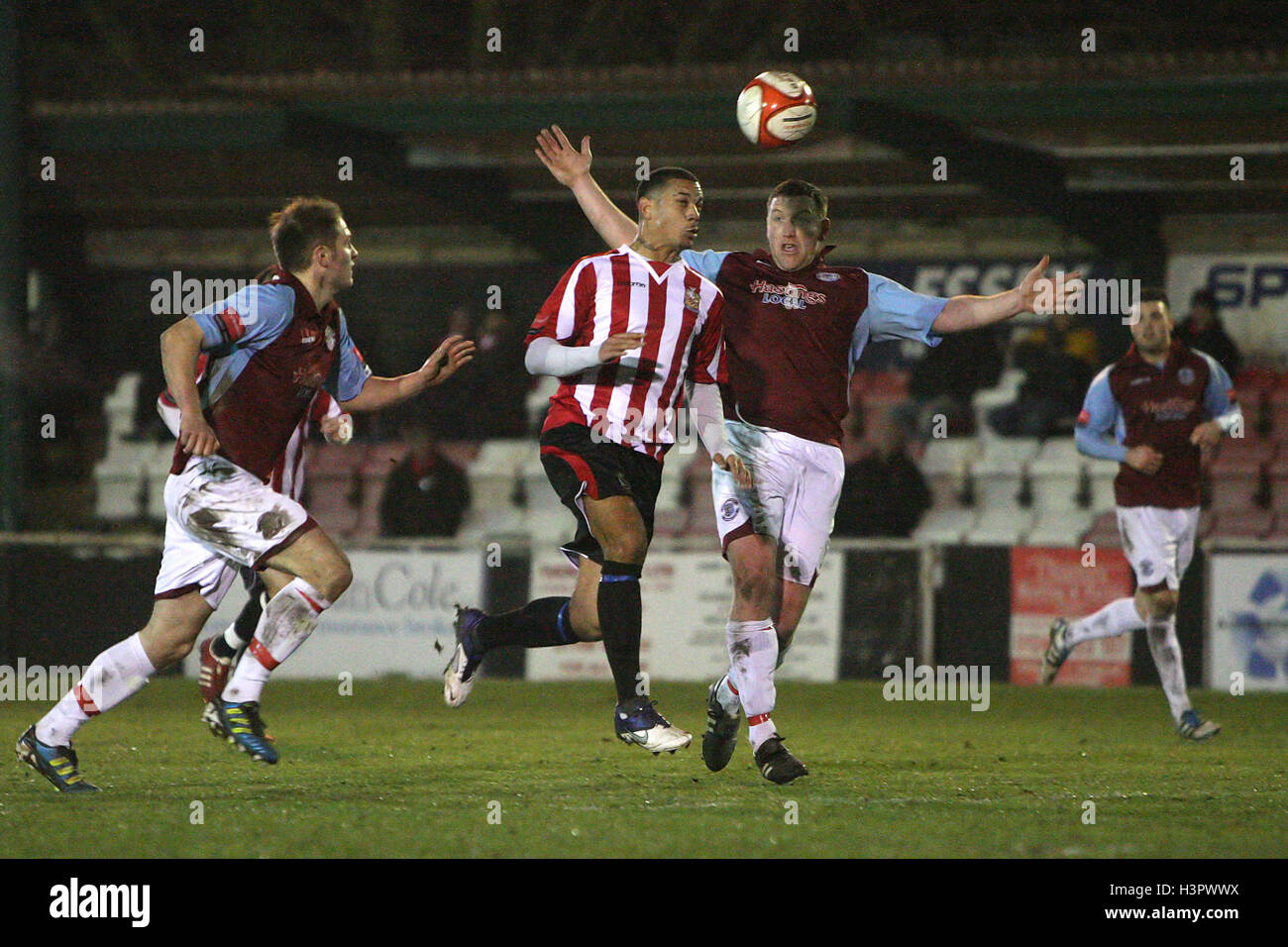 Leon McKenzie of Hornchurch gets to the ball ahead of Sean Ray of ...