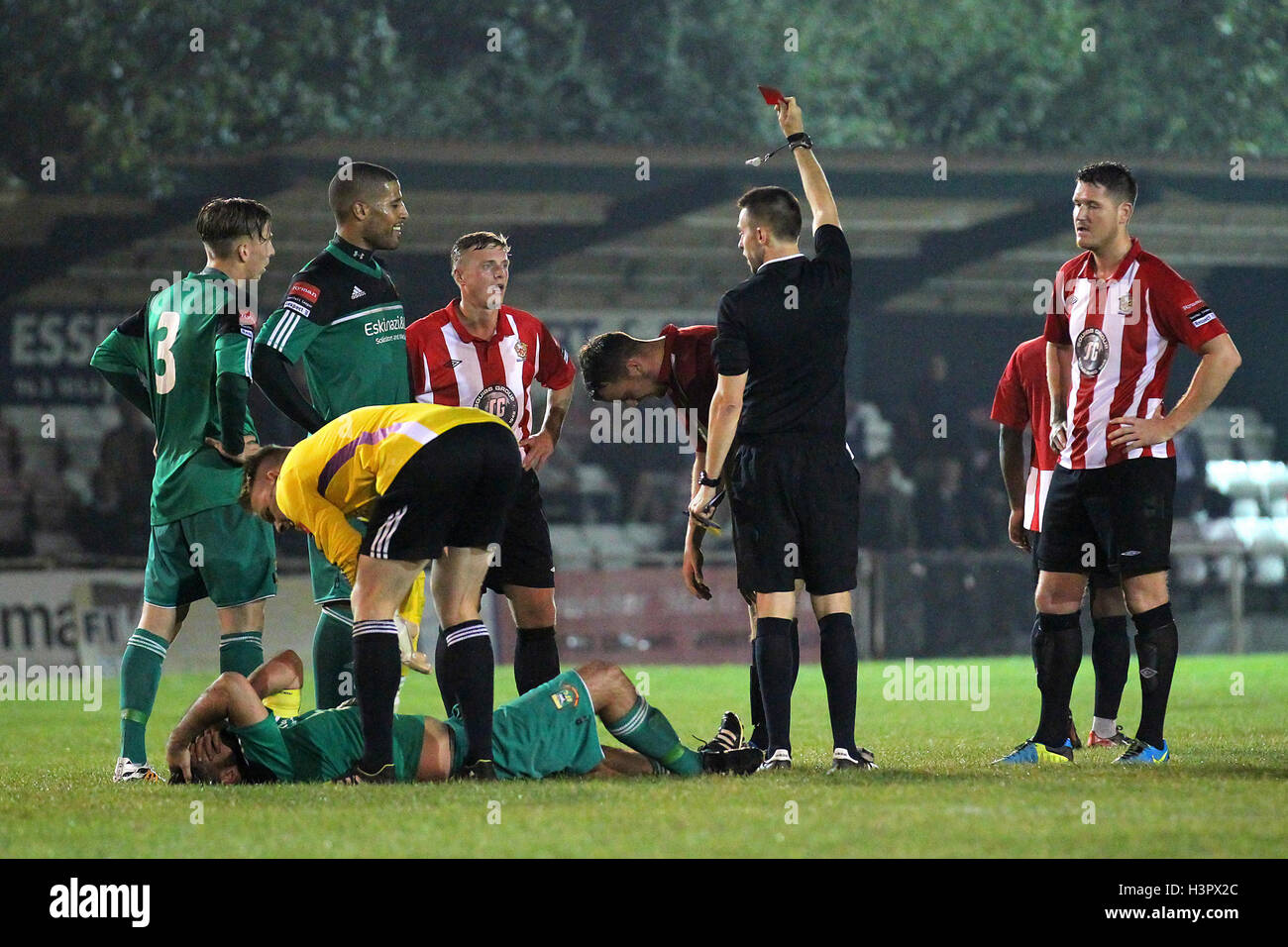 Danny Johnson (head bowed) is sent off by referee Garry Maskell for a ...