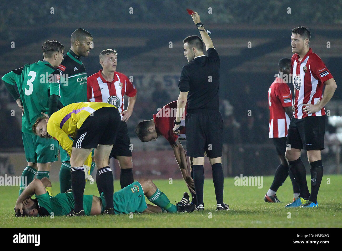 Danny Johnson (head bowed) is sent off by referee Garry Maskell for a ...