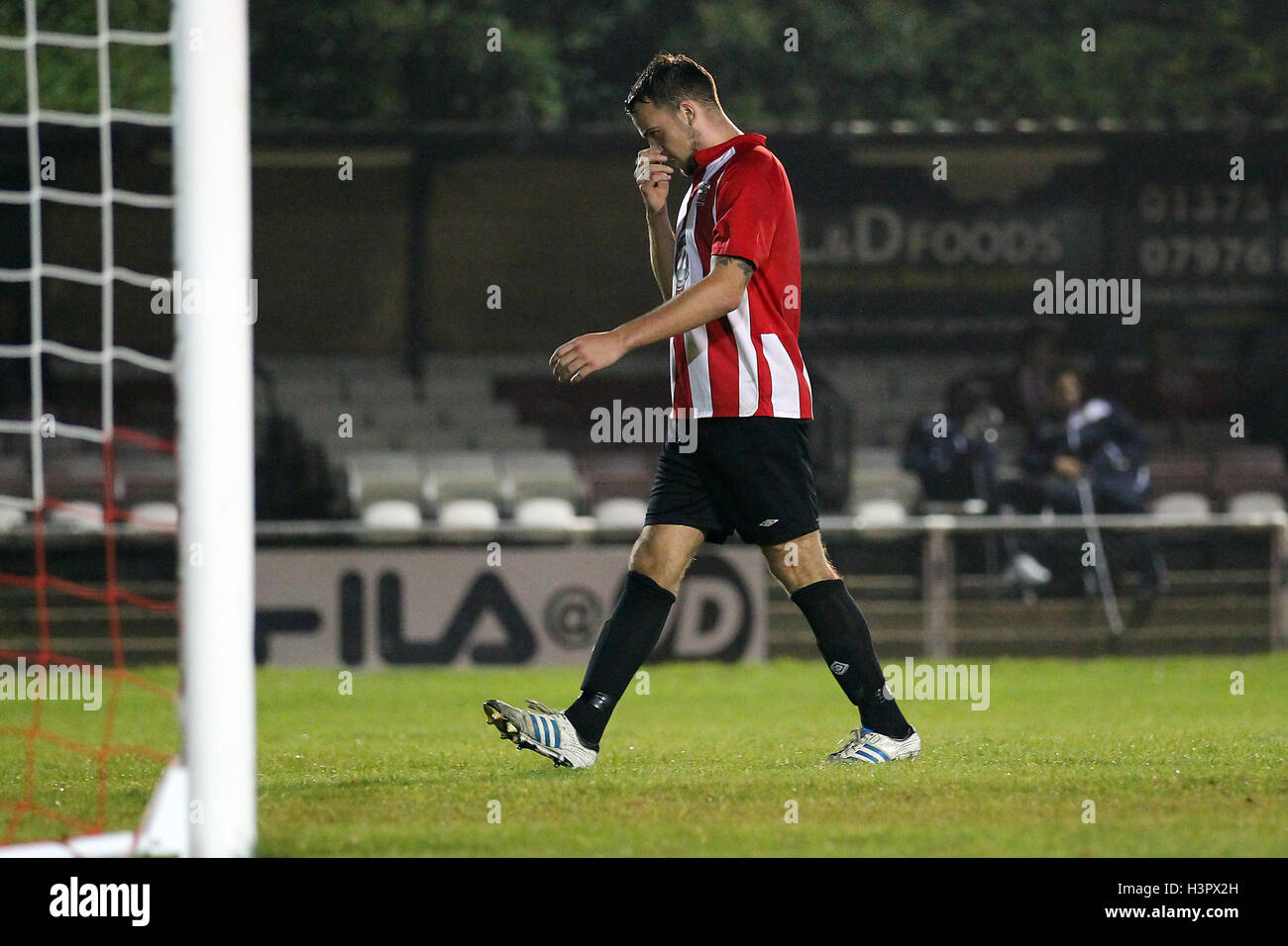 Danny Johnson leaves the field having been sent off by referee Garry ...