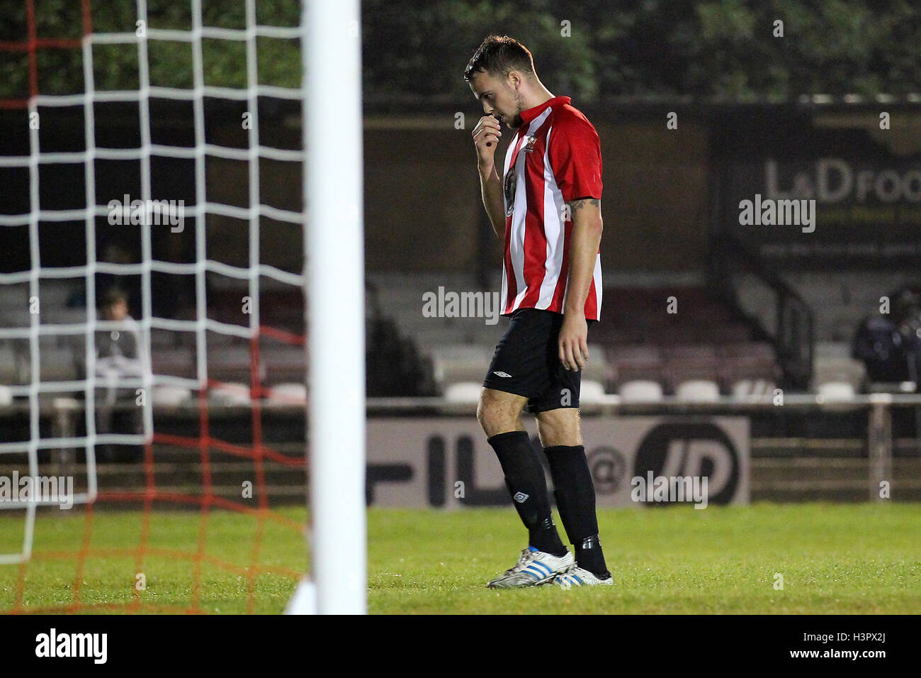 Danny Johnson leaves the field having been sent off by referee Garry ...