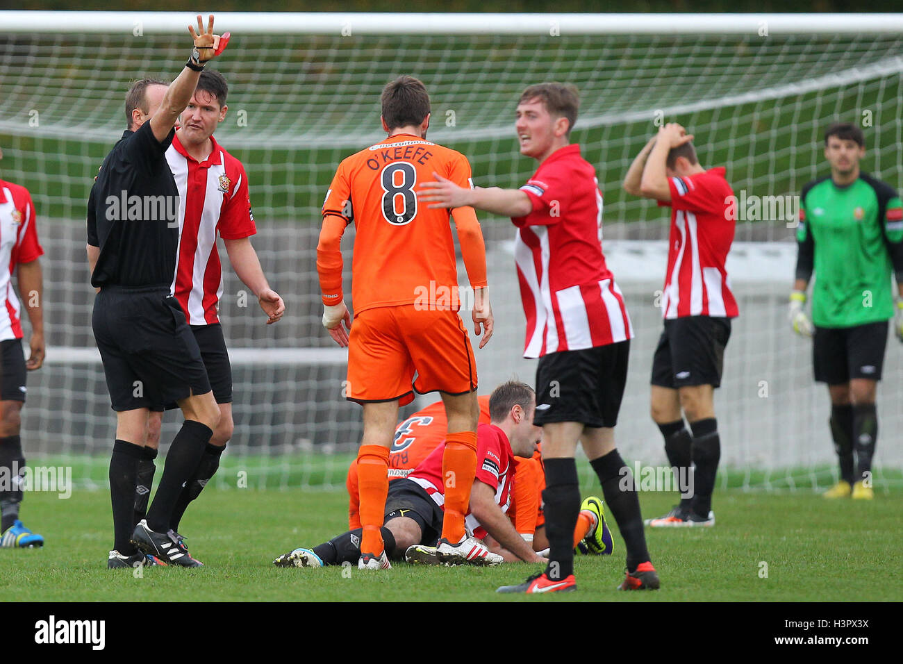 Elliot Styles of Hornchurch (on ground) fouls Chris Bush of Hereford ...