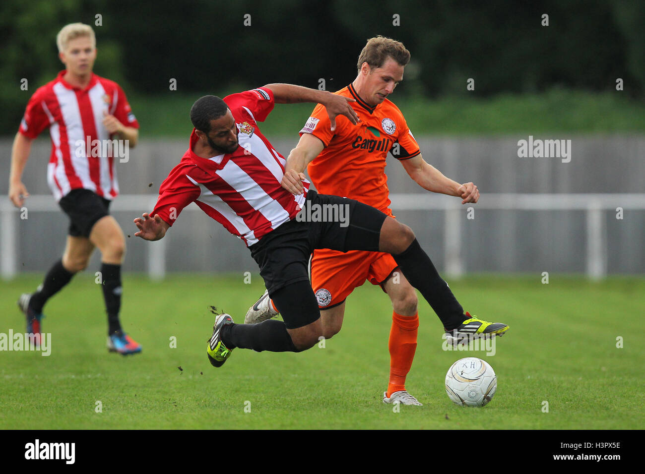 Michael Spencer of Hornchurch tackles Rob Purdie of Hereford United ...