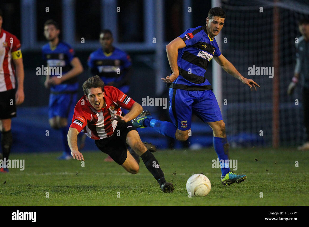 Tommy Kavanagh of Kingstonian sends Leigh Bremner of AFC Hornchurch ...