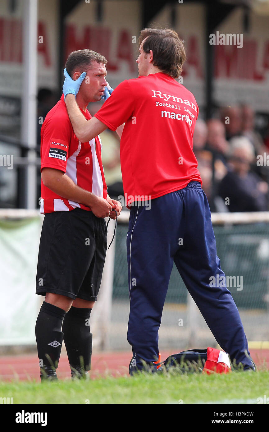 Billy Coyne of Hornchurch receives treatment for a facial injury - AFC ...