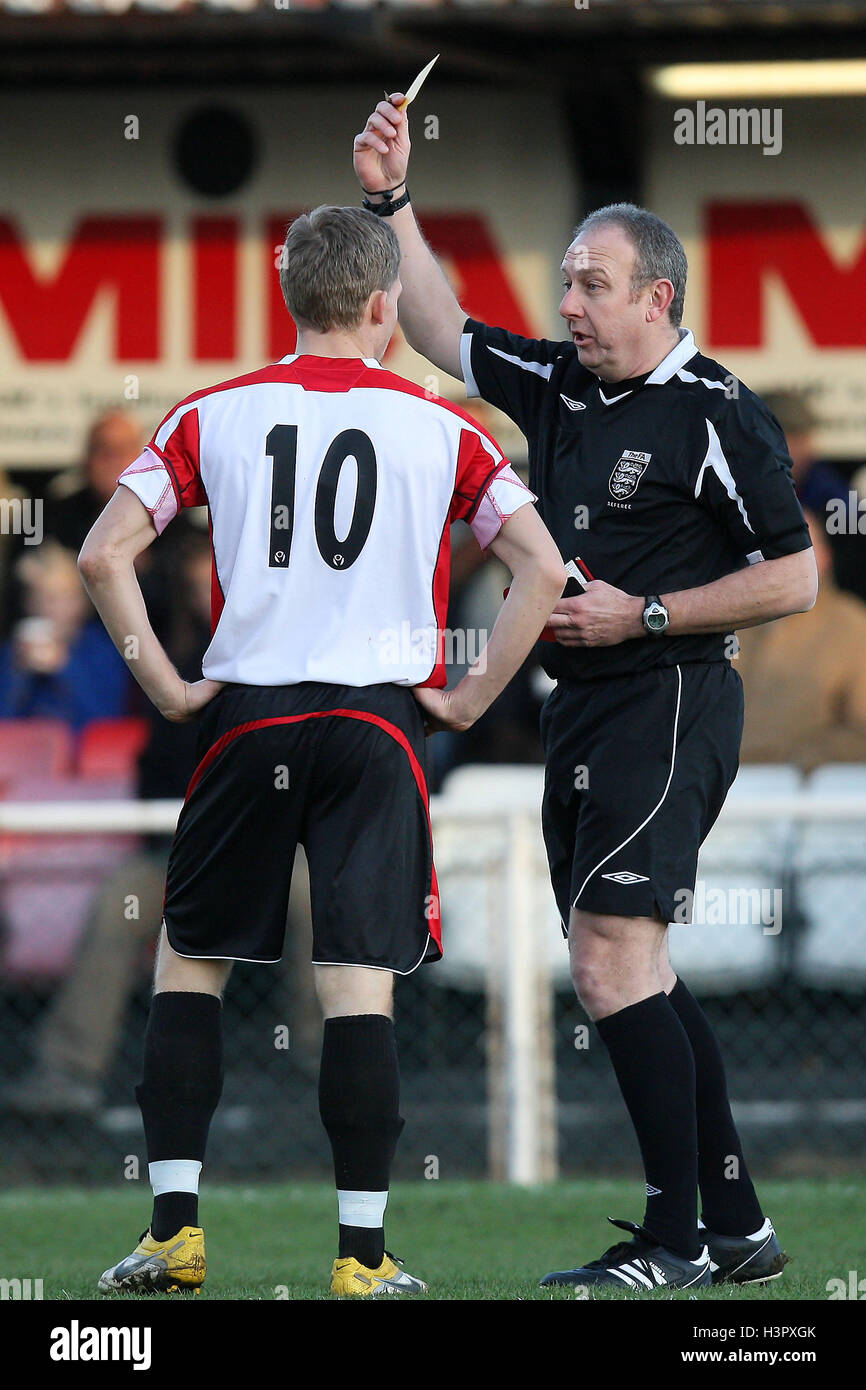 Lewis Smith of Hornchurch receives a yellow card from referee Tomlinson ...