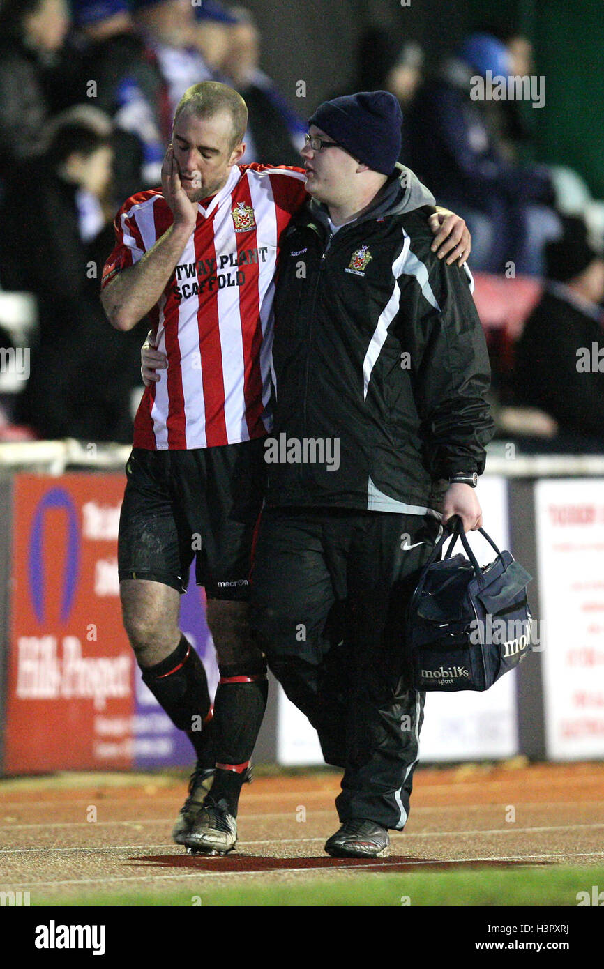 Elliot Styles of Hornchurch leaves the game with an injury to his chin ...