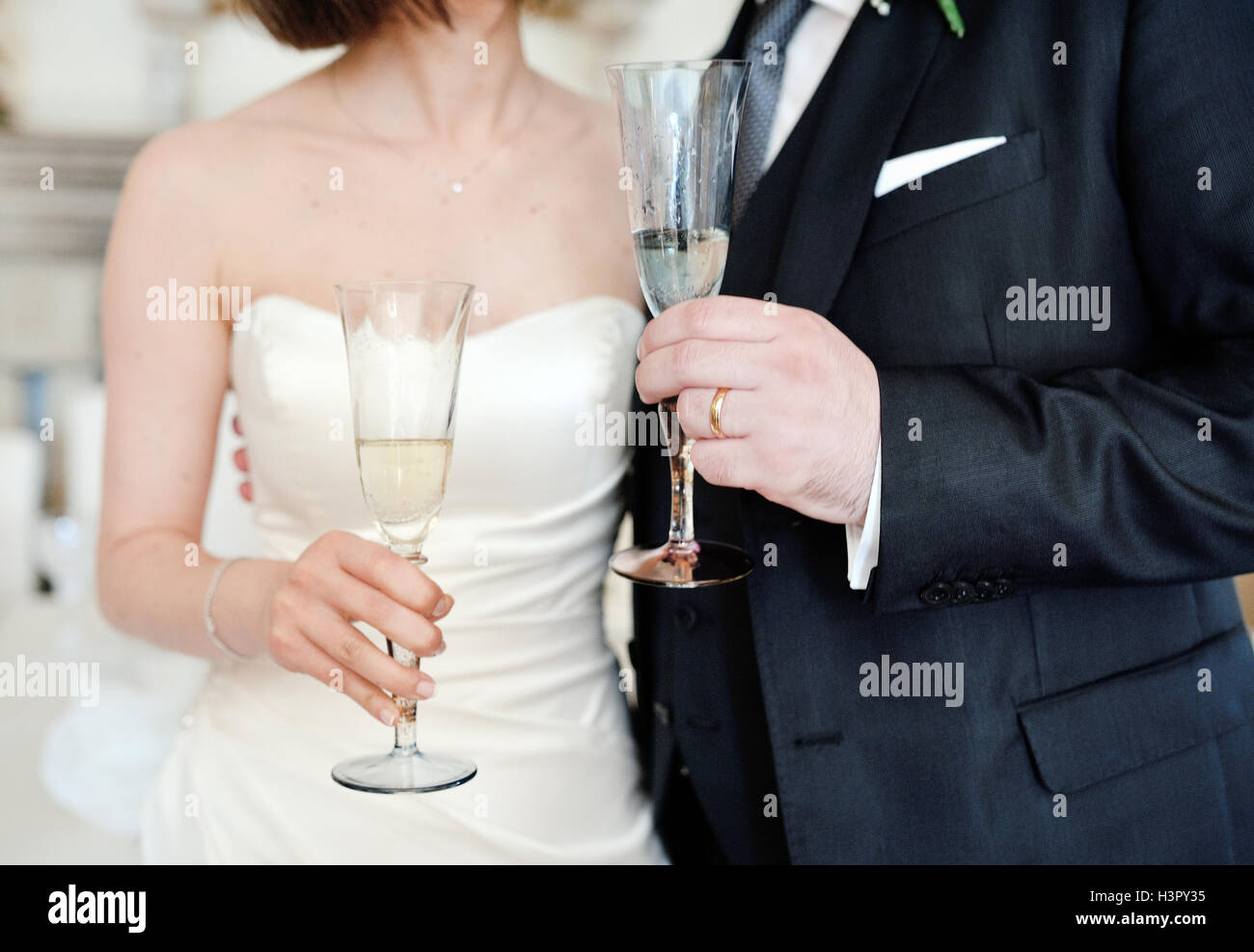 Bride and groom with champagne glass making a toast at the wedding ...