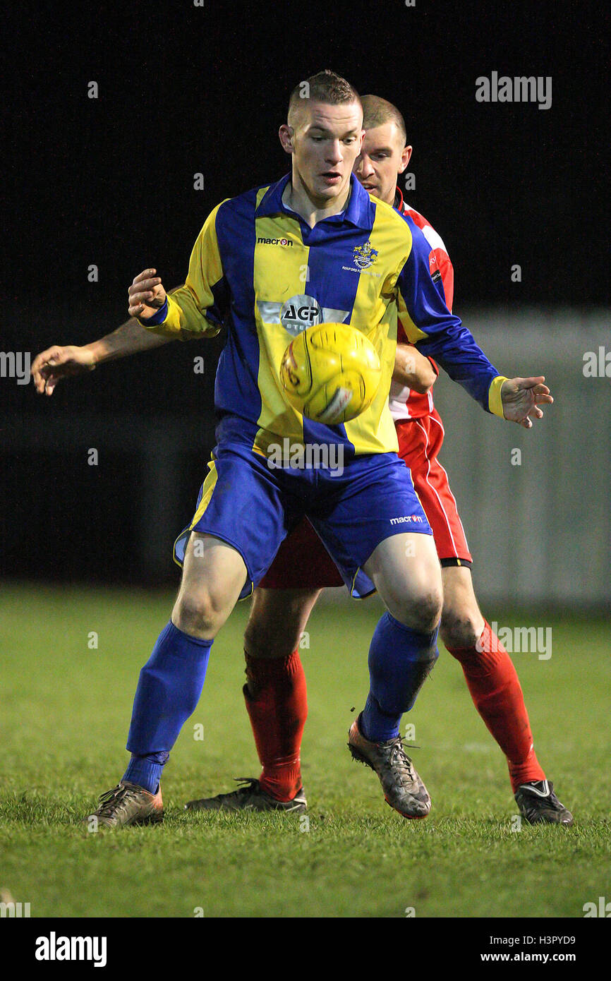 Alex Read of Romford shields the ball from Dave McSweeney of Hornchurch ...