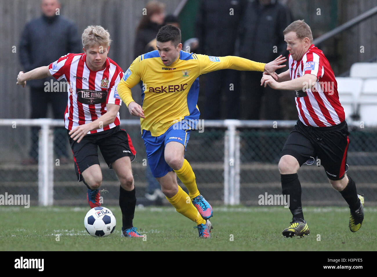 Dan Fitchett of Salisbury battles it out with Andy Tomlinson (R) and ...