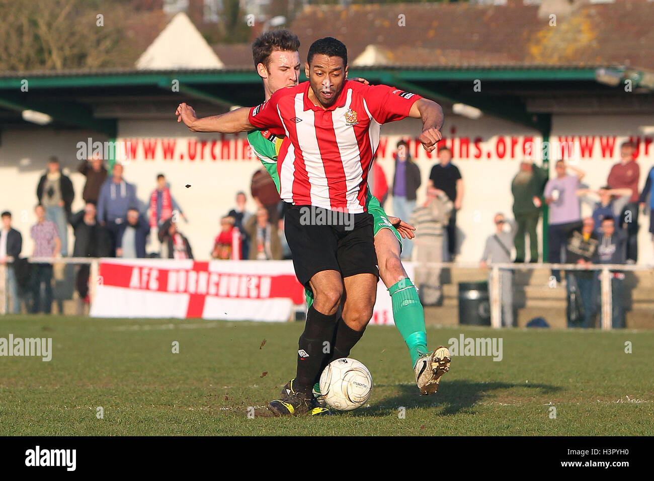 Dave Rainford of Hornchurch takes a tumble in the penalty area under ...