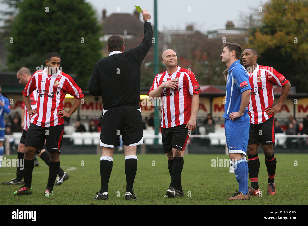 Dave Collis of Hornchurch receives a yellow card from referee Forrester ...